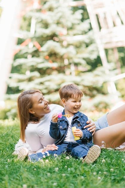 Premium Photo Beautiful Cute Young Mom With Her Cute Little Son