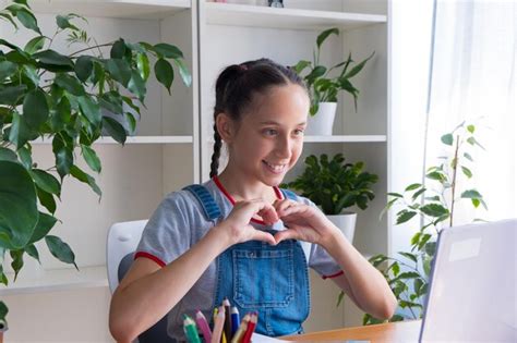 Premium Photo Brunette Years Old Dressed In A Gray Tshirt Sitting At Home Studying Writing