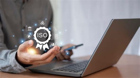 premium photo businessman iso symbol showing quality assurance on virtual screen