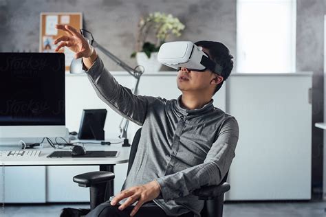 Businessman Wearing Vr In Office By Stocksy Contributor Maahoo Stocksy