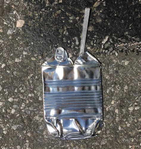 Squashed Can With Straw Cropped Improvised Life