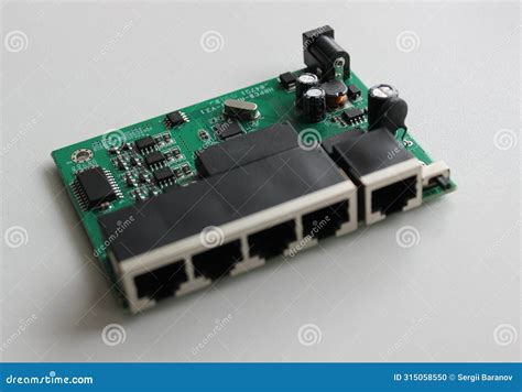 Disassembled Ethernet Switch With Connectors For Network Wires Without Top Cover Stock Photo