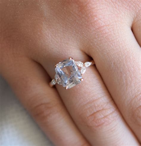 Emerald Cut White Sapphire Engagement Ring Rose Gold Trillium Setting