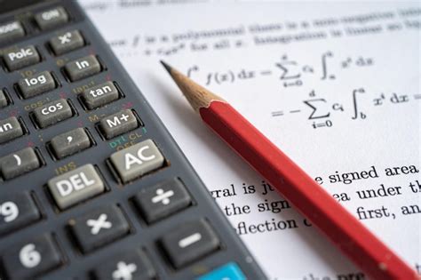 Premium Photo Pencil And Calculator On Mathematic Formula Exercise Test Paper In Education School