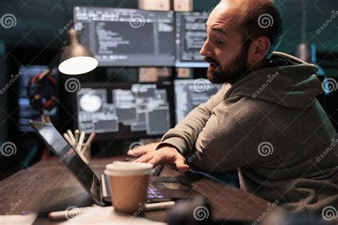 Database Programmer Writing Code on Multiple Screens Stock Image ...