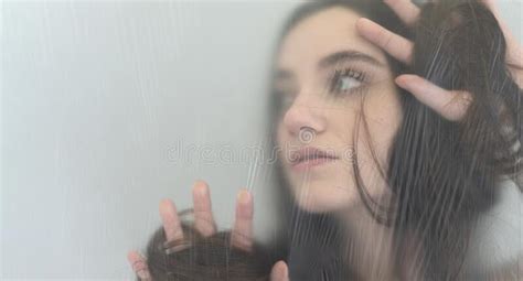 Blurred Out Of Focus Portrait Of Beautiful Sensual Seductive Lockdown Woman Behind Transparent