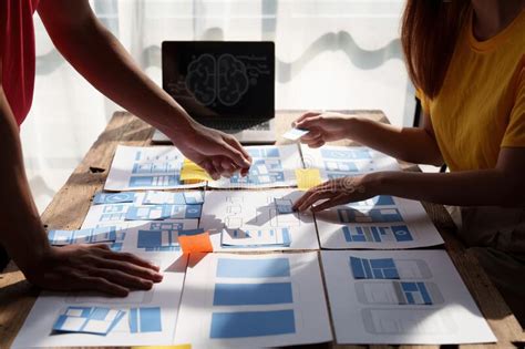 group of ux developer and ui designer brainstorming about app interface