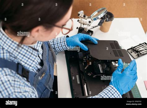 Laptop Disassembling At Electronic Repair Shop Female Engineer Separating Computer From Case