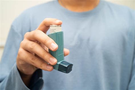 Asthma And Chronic Obstructive Pulmonary Disease Copd Asian Young Man Using Metered Dose