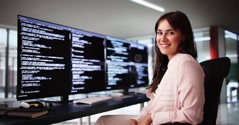 programmer woman coding on multiple computers stock image image of