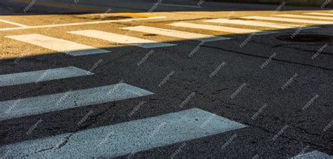 Premium Photo City Crosswalk With Pedestrians Crossing Road Traffic Signals And Buildings In