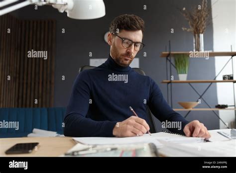 Architect Working In Office With Blueprintsengineer Inspect Architectural Plan Sketching A