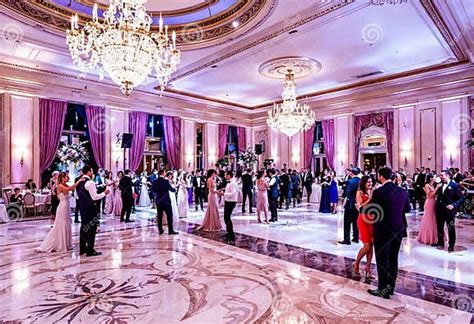 Elegant Ballroom Dance Event Featuring Couples In Formal Attire Under