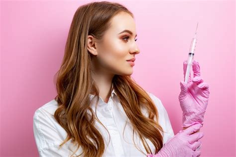 Premium Photo Girl Wearing Surgery Gloves And Holding A Syringe