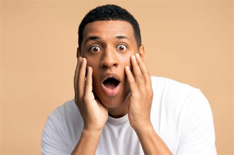 Premium Photo Latin Man Looking With Big Eyes Scared Surprised
