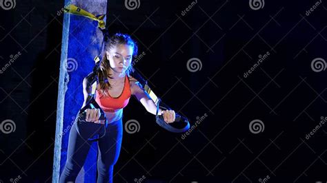 Athletic Woman Performs Exercises With Fitness Trx System Trx