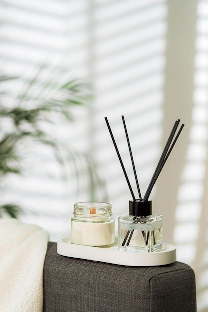 Aroma Diffuser Bottle With Sticks In Living Room Premium Photo