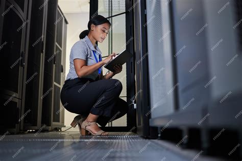 Premium Photo Engineer Server Room And Woman With Tablet For Database Connection Cable