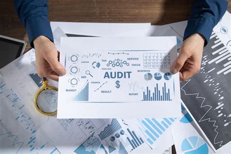 Premium Photo Man Showing Audit Business Charts With Words