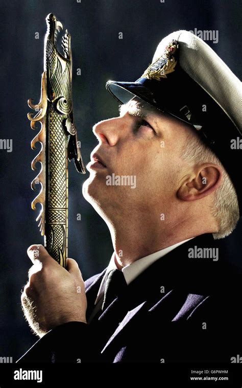 Customs Officer Patrick Mcgroarty Takes A Close Look At A Blow Pipe