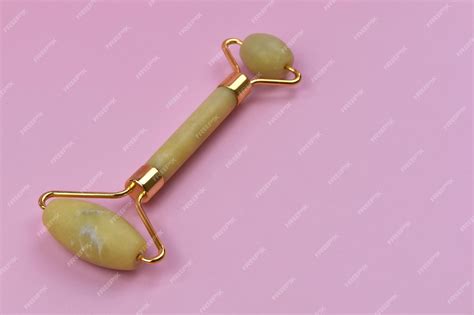 Premium Photo Gua Sha Face Tool Green Stone Massage Roller On A
