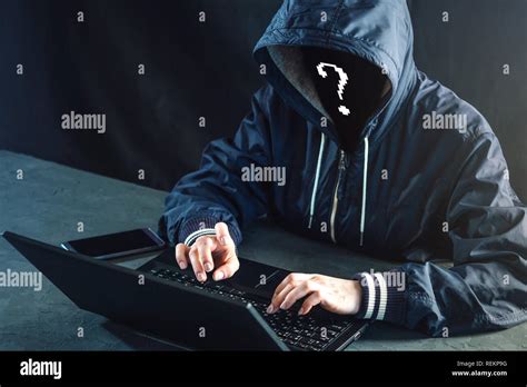 Anonymous Hacker Programmer Uses A Laptop To Hack The System Stealing Personal Data Creation