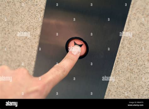 A Hand Pushing Elevator Buttons Stock Photo Alamy