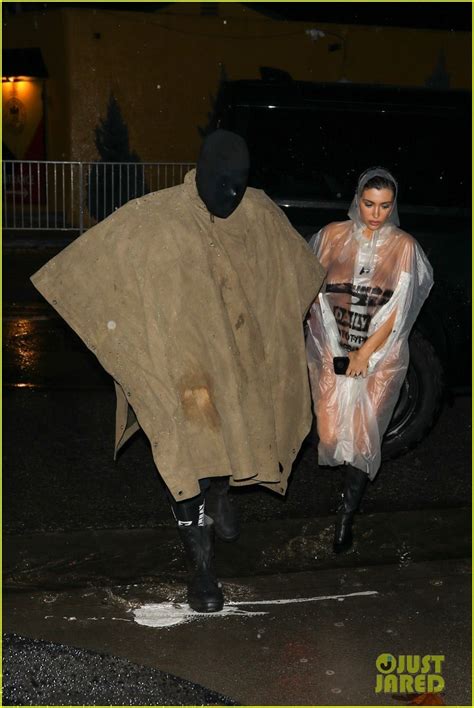 Kanye Wests Wife Bianca Censori Braves The Rain In See Through Poncho