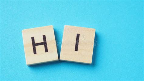 The Word Hi From Wooden Cube Letters On A Blue Background Stock Image