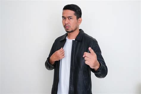 Premium Photo Adult Asian Man Pointing Towards Camera With Threatening Expression