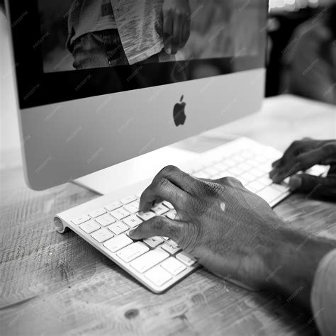 Premium Photo Person Typing On Keyboard At Desk