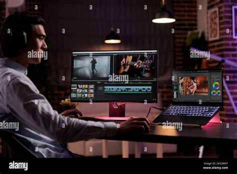 Asian Editor Working On Movie Production With Computer Software