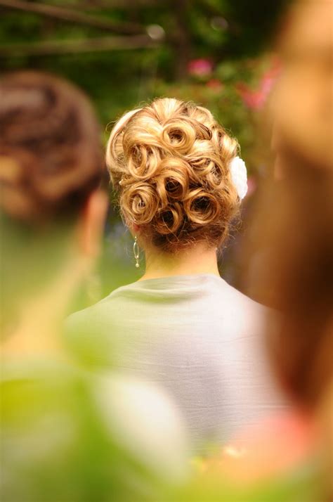 Loose Curl Updo And Flower Pin