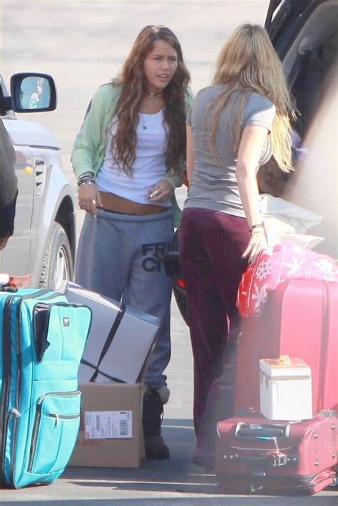 Miley Cyrus Boarding Airplane At Burbank Airport December 20 2008