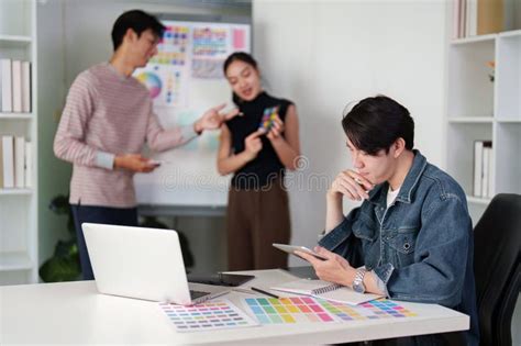 Creative Workflow And Inspiration A Graphic Design Team Collaborating Over Color Palettes And