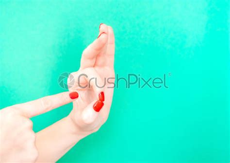 Woman Hand Shows Rock N Roll Hand Signs Isolated On Stock Photo Crushpixel