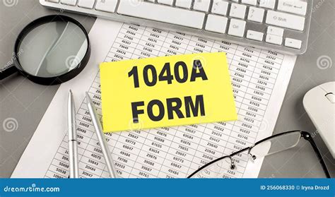 1040 A Form Text Written On A Sticky On Chart With Keyboard And