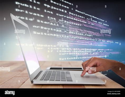 Hand Using Laptop With Coding Text Stock Photo Alamy
