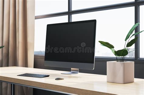 Minimalistic Workspace With A Desktop Monitor Keyboard Mouse And A Potted Plant On A Wooden