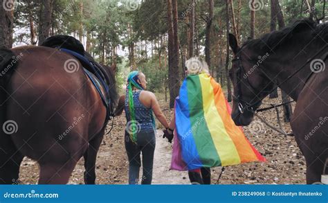 Lgbt Rainbow Flag Young Lesbian Same Sex Couple Is Engaged In Joint