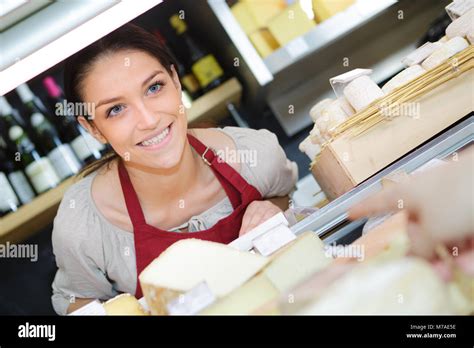 Happy Female Brunette With Different Types Of Cheese Stock Photo Alamy