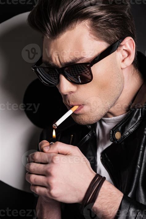 Lighting A Cigarette Handsome Male Model In Leather Jacket Lighting A Cigarette 13525289 Stock
