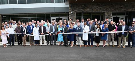 Group Photo Of Ribbon Cutting
