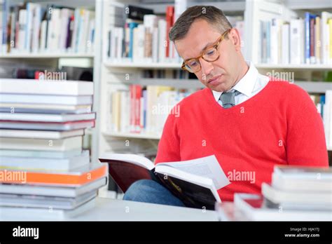 Man Reading In Library Stock Photo Alamy