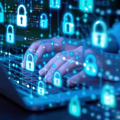Close Up Of Hands Typing On Laptop With Security Icons Floating Above Dark Background With