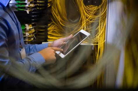 Premium Photo Technician Using Digital Tablet