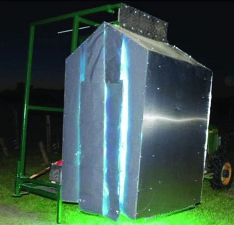 the tractor mounted vineyard uvc application unit in operation at night
