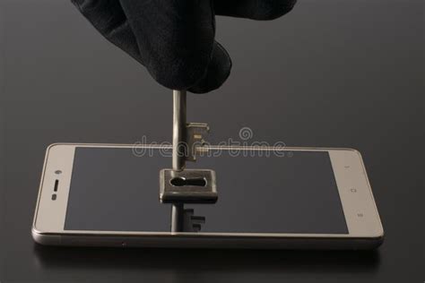 The Hand Of An Attacker In A Black Glove Opens The Lock On A Smartphone