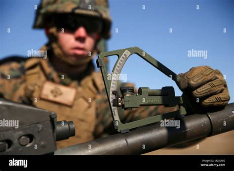 A Marine Measures The Mk19s Muzzle Elevation Based On Calculations