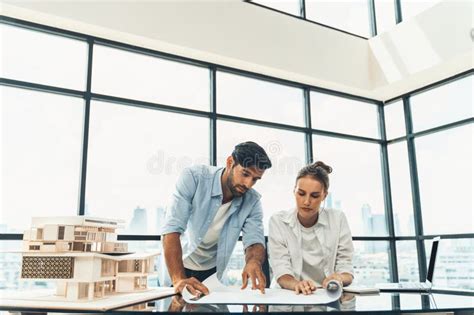 Professional Architect Team Working Together To Design House Model